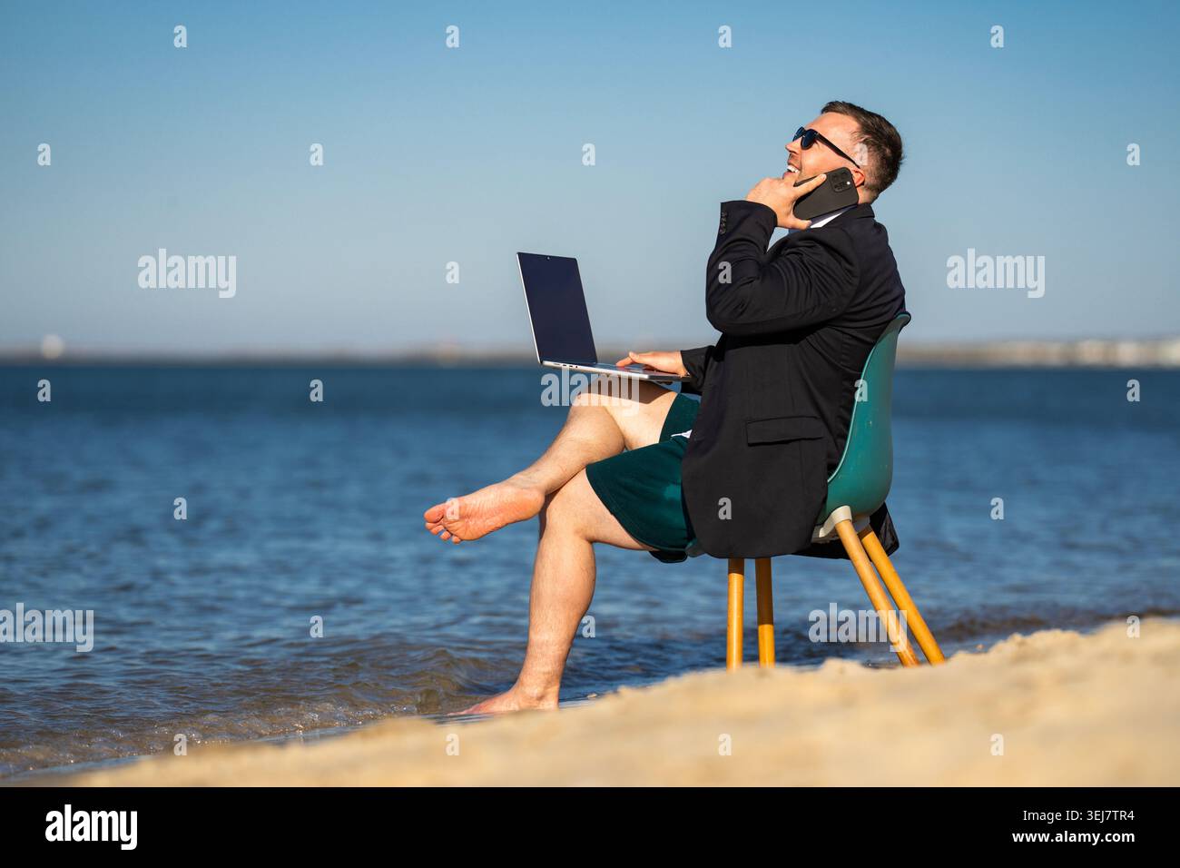 Sea office shows remote working. Man working remotely near water ...