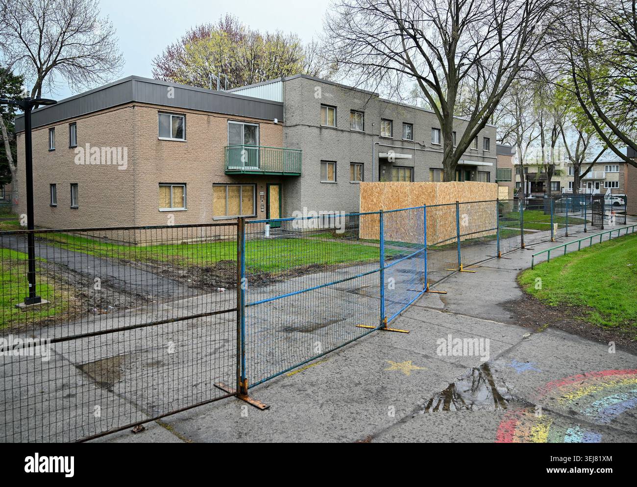 A boarded up apartment building is shown in a social housing complex in ...