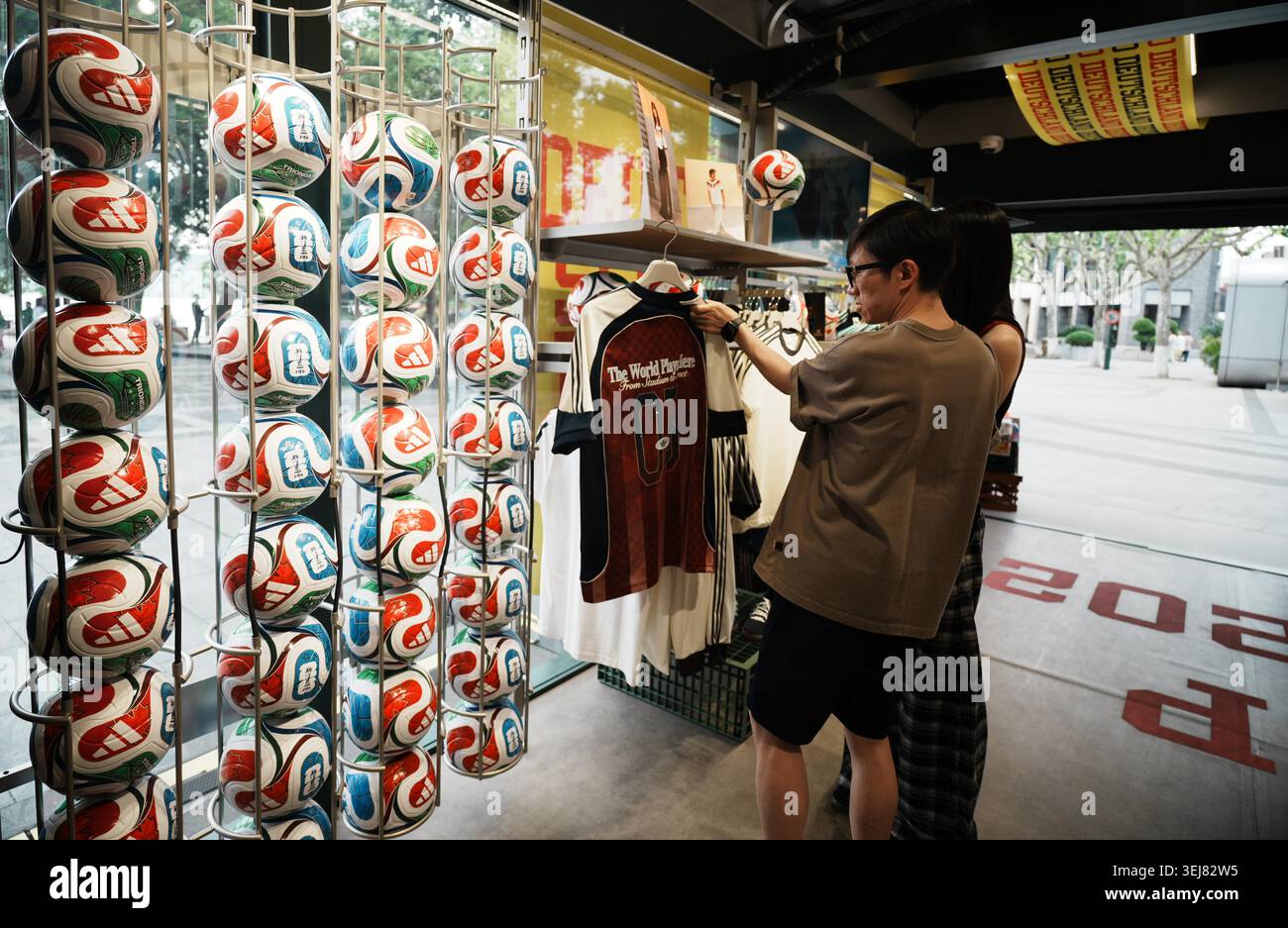 Customers shop for national team jerseys at the 2026 World Cup pop-up ...