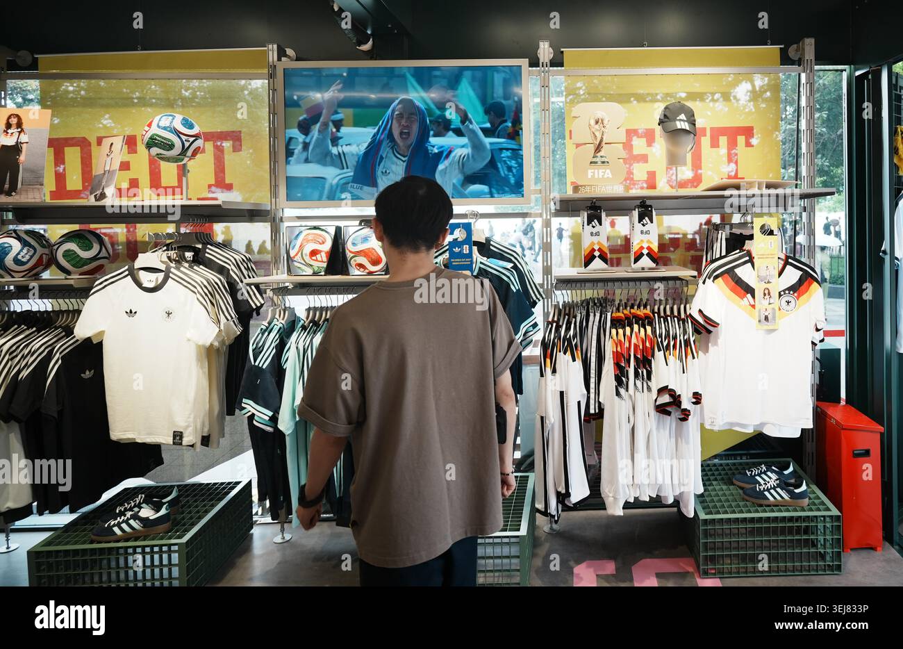 Customers select national team jerseys at a 2026 World Cup pop-up store ...