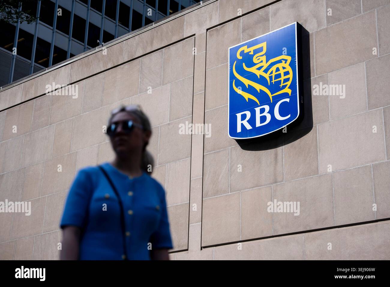 People walk past the Royal Bank Tower in Montreal on Thursday, June 19 ...