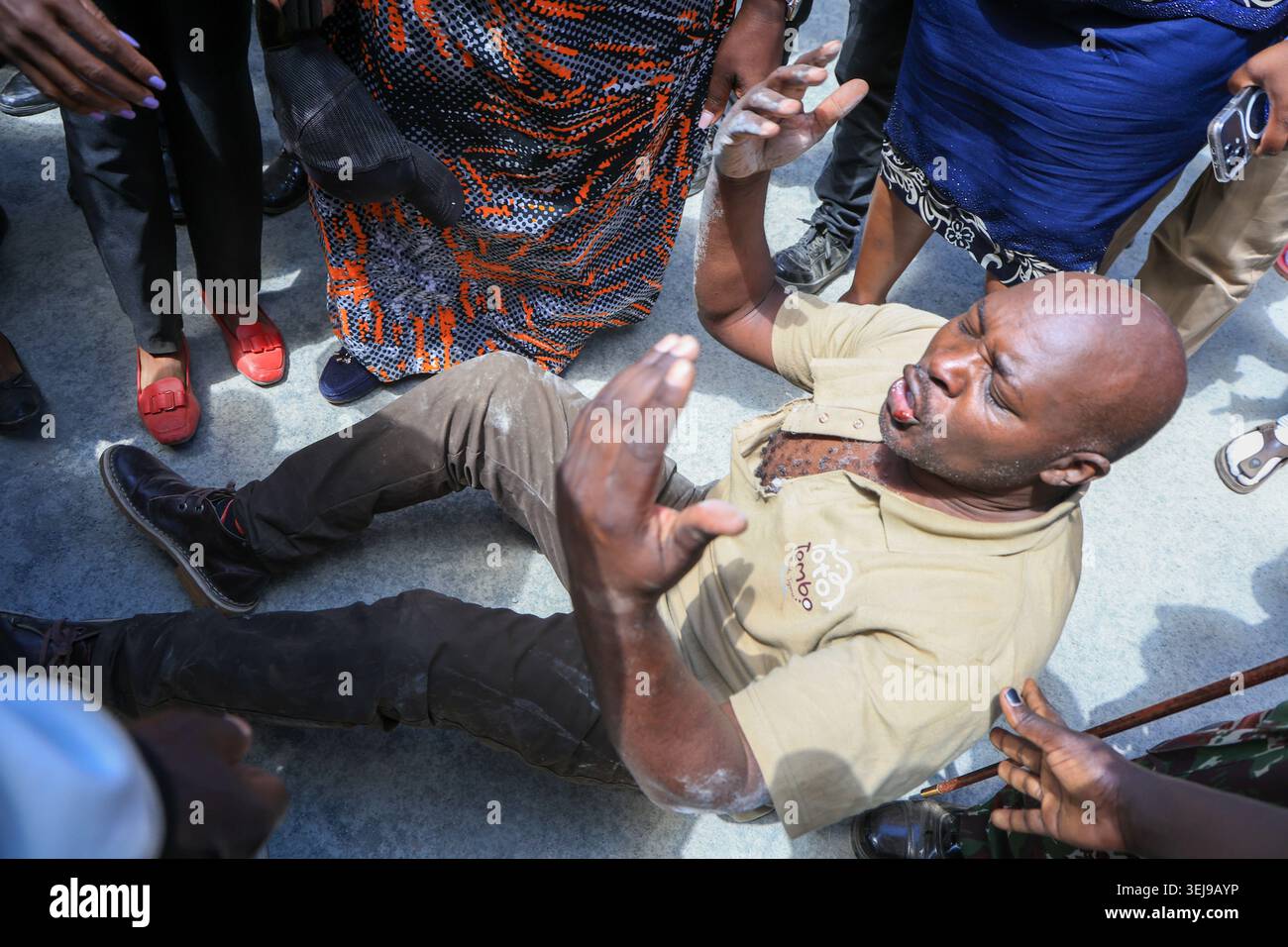 A parent reacts after a fire at Utumishi Girls School in Gilgil ...