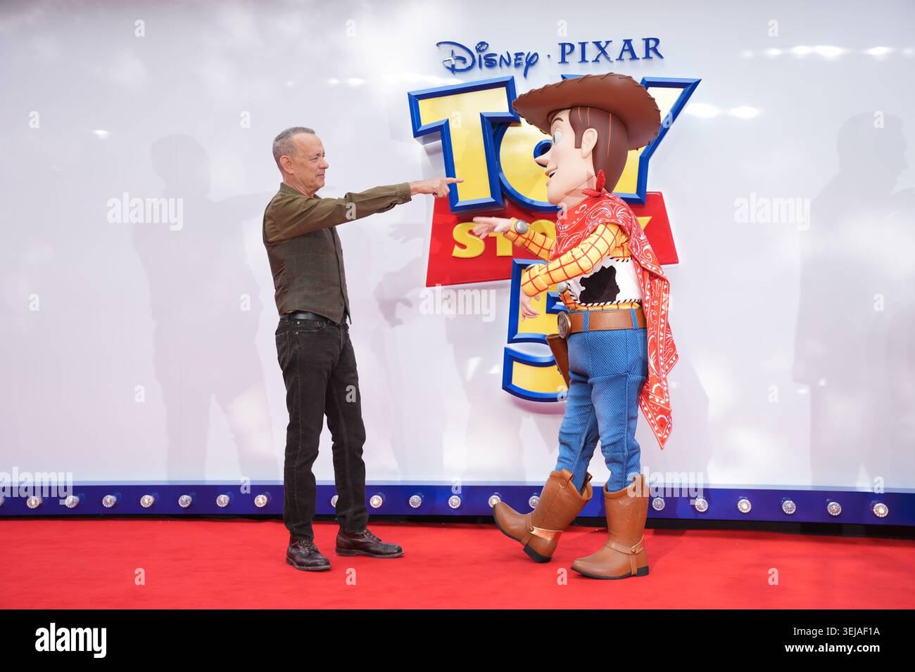 Tom Hanks (left) and Toy Story character Woody at a launch event for ...