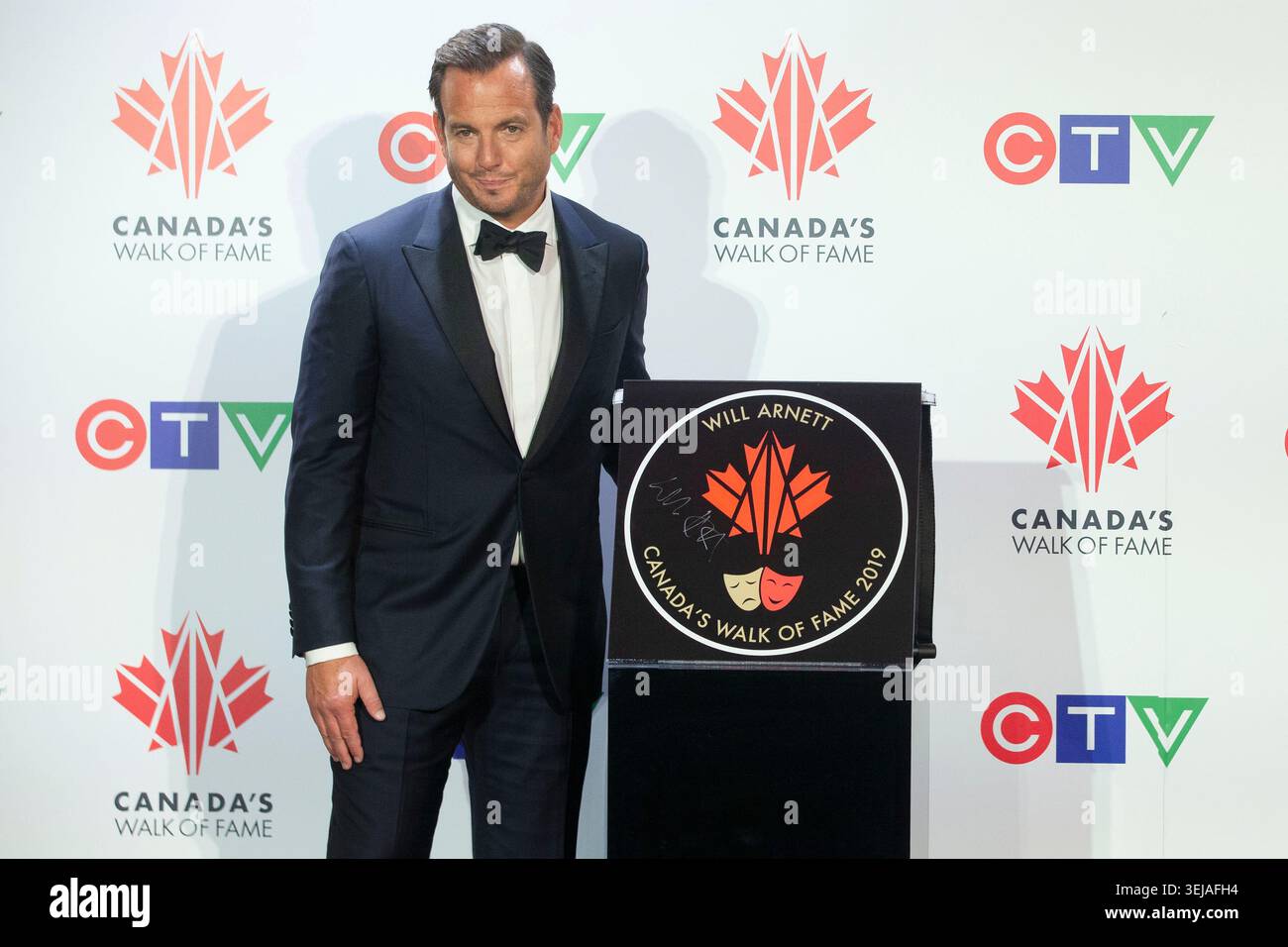 Actor Will Arnett is pictured with his star as he is inducted into ...