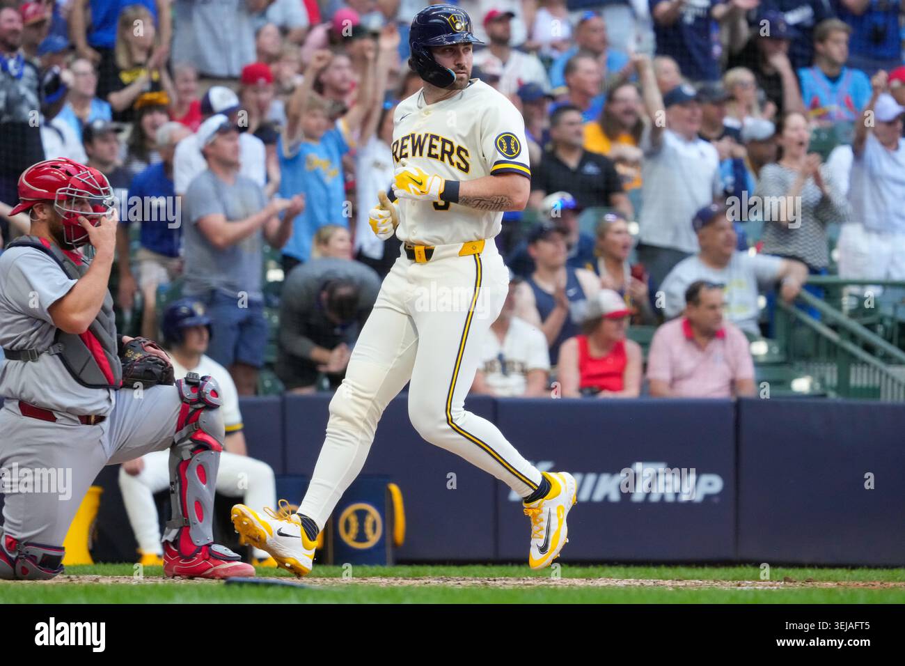 Milwaukee Brewers' Garrett Mitchell (5) scores on an RBI single hit by ...