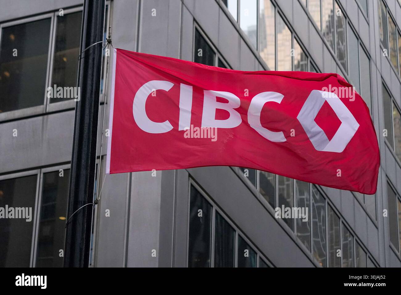 The new CIBC logo displayed on a flag in front of its headquarters in ...