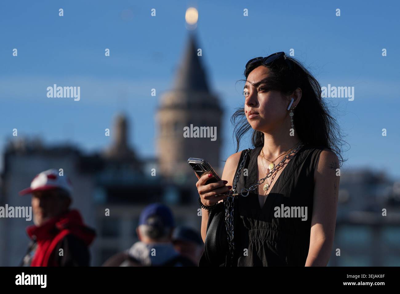 May 25, 2026, Istanbul, Turkey: A young woman walks across the Galata ...