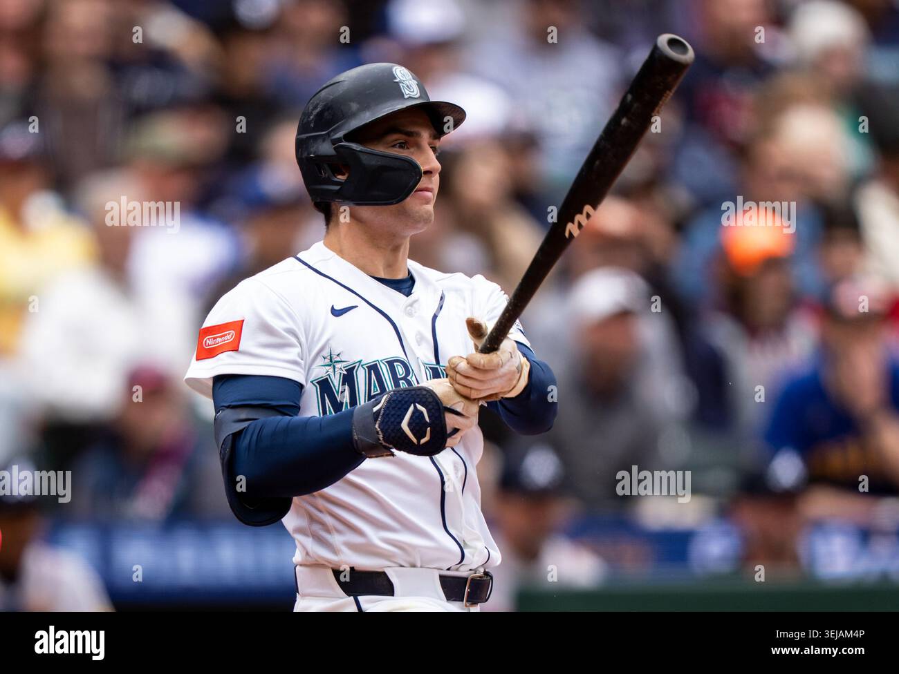 Seattle Mariners' Cole Young takes a swing during an at-bat in a ...