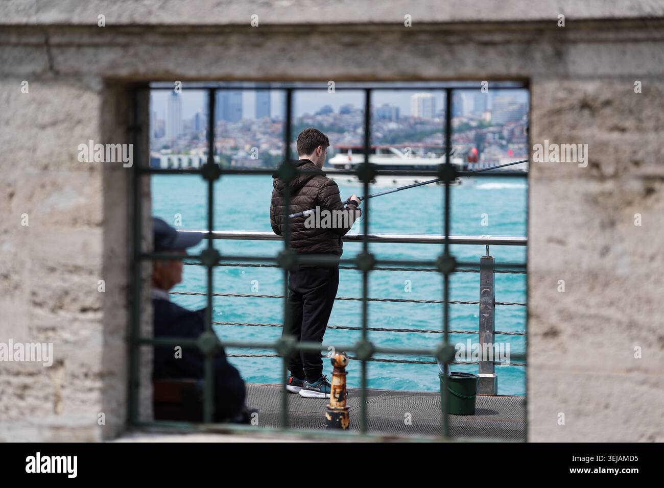 May 24, 2026, Istanbul, Turkey: A fisherman fishes in the Bosphorus ...