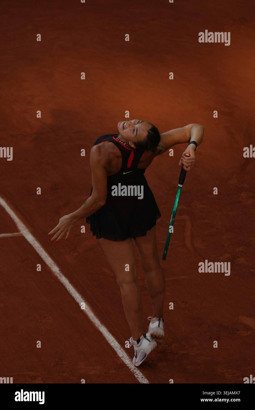 Aryna Sabalenka of Belarus serves to Elsa Jacquemot of France during ...