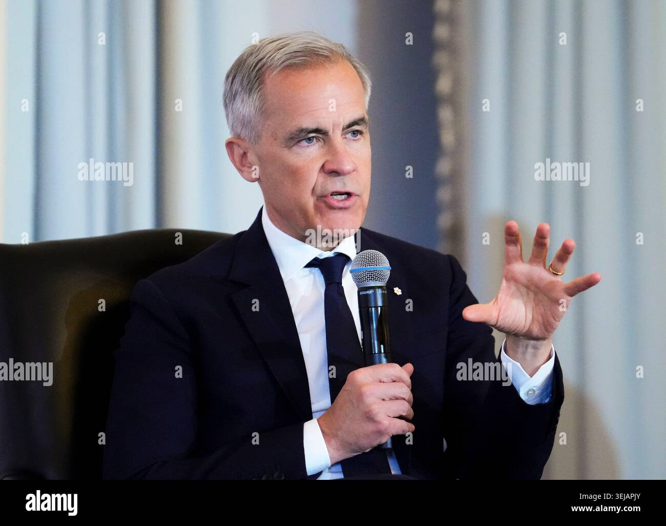 Canadian Prime Minister Mark Carney delivers a speech and takes part in ...