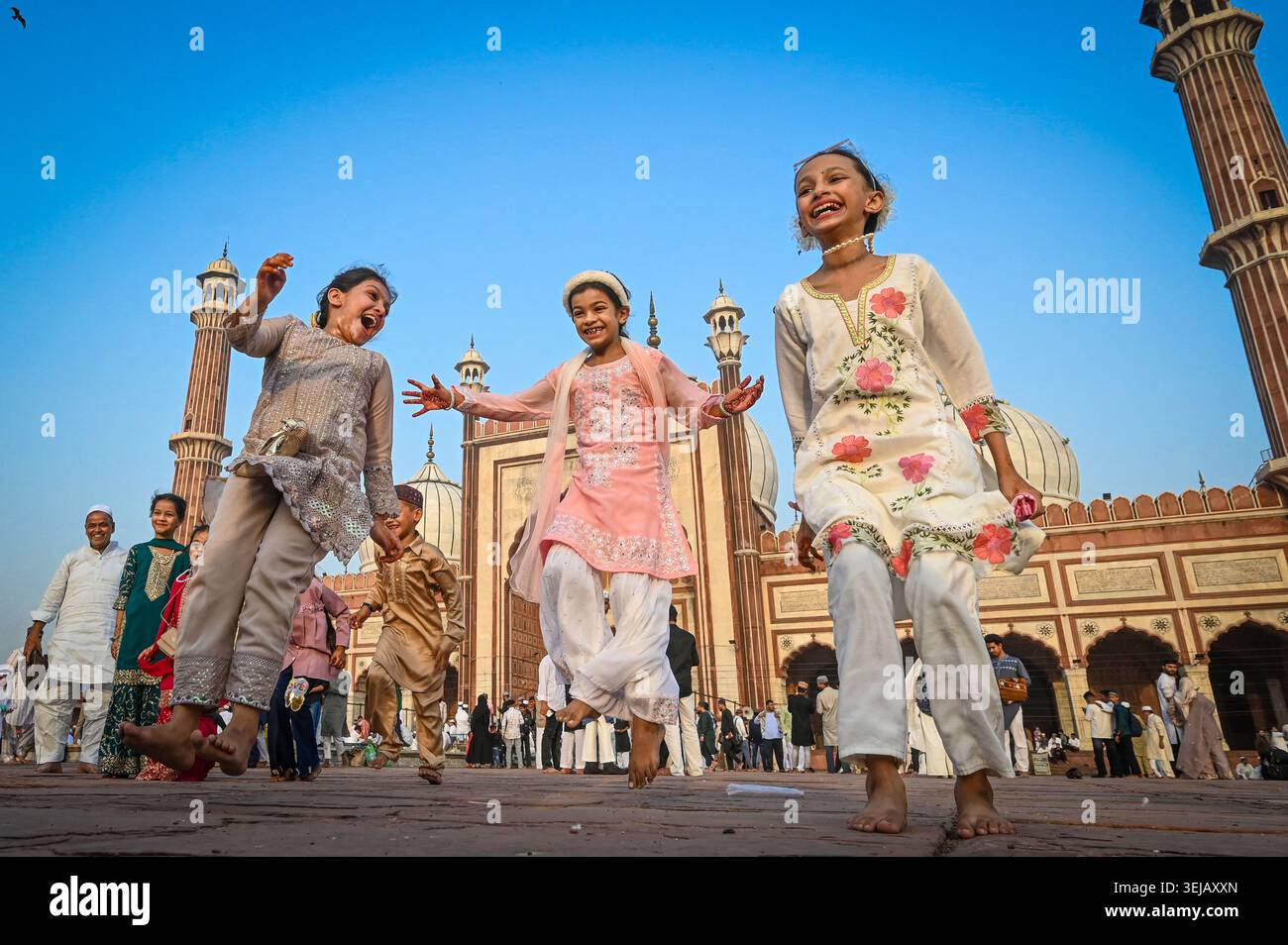 NEW DELHI, INDIA - MAY 28: Muslim children dressed in festive attire in ...