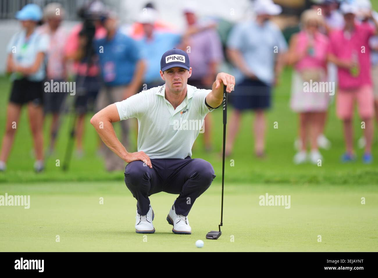 Alex Smalley prepares to putt on the ninth green during the first round ...