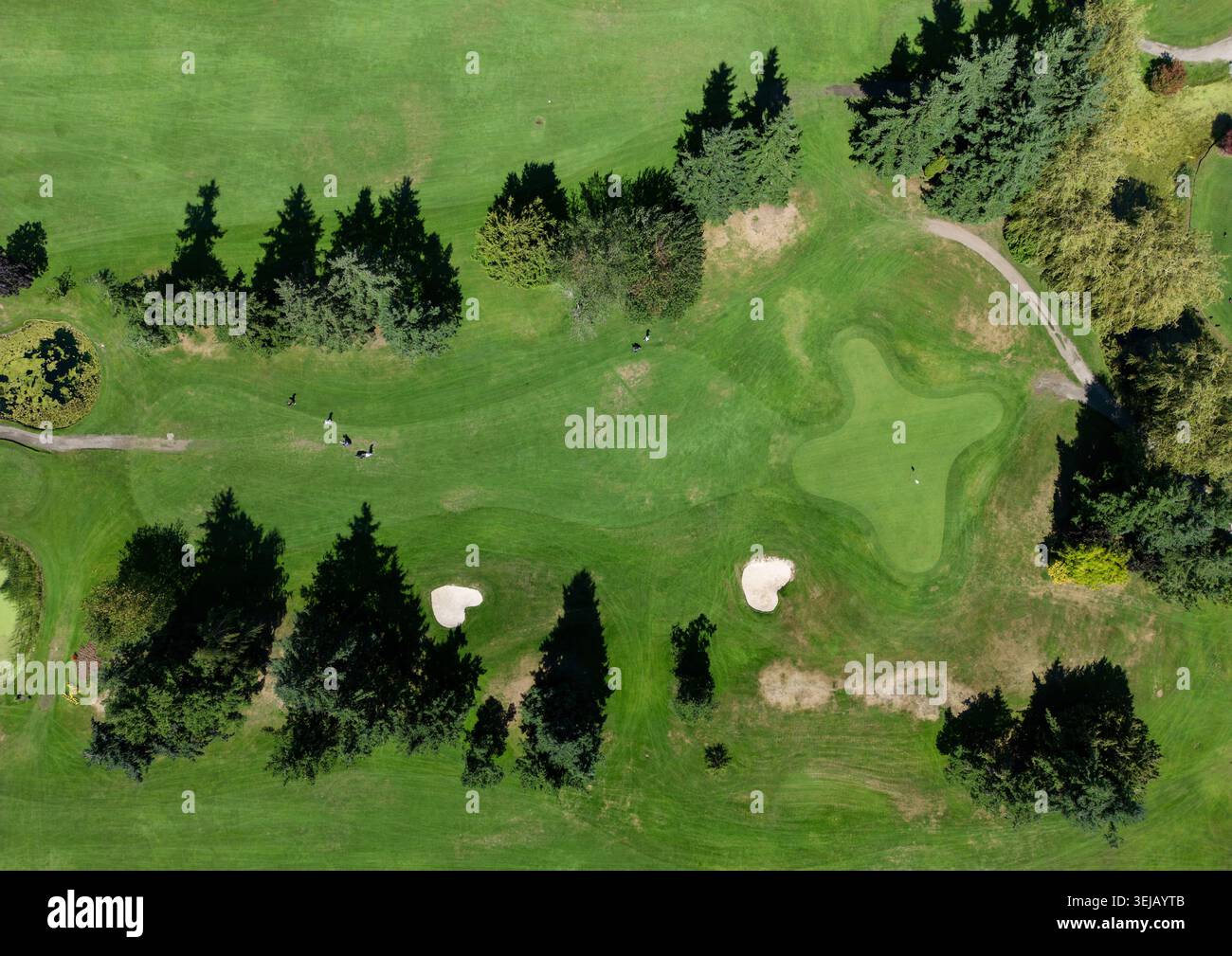 Golfers walk on the first hole at Country Meadows Golf Course, which ...
