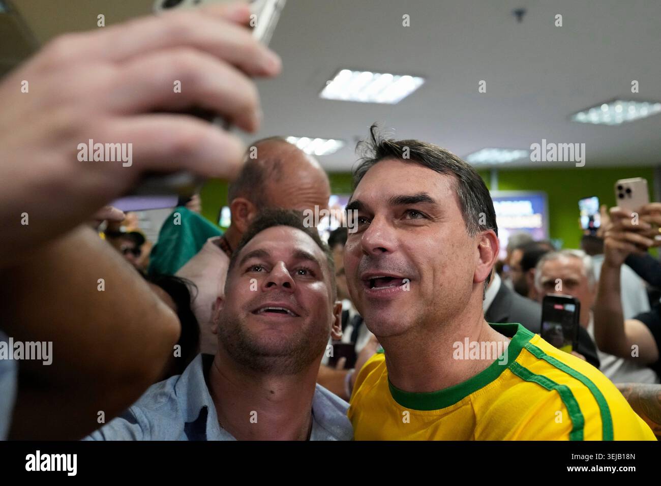 Sen. Flavio Bolsonaro poses for a selfie with a supporter upon arriving ...
