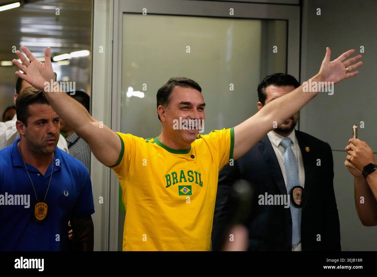 Sen. Flavio Bolsonaro reacts upon arriving at Brasília International ...