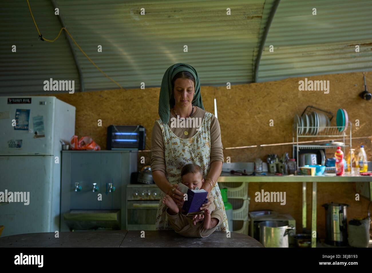 Israeli settler parents travel with their baby on camels in the ...