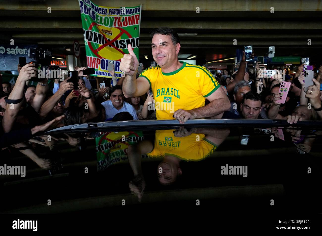 Sen. Flavio Bolsonaro gives a thumbs up to supporters upon arriving at ...