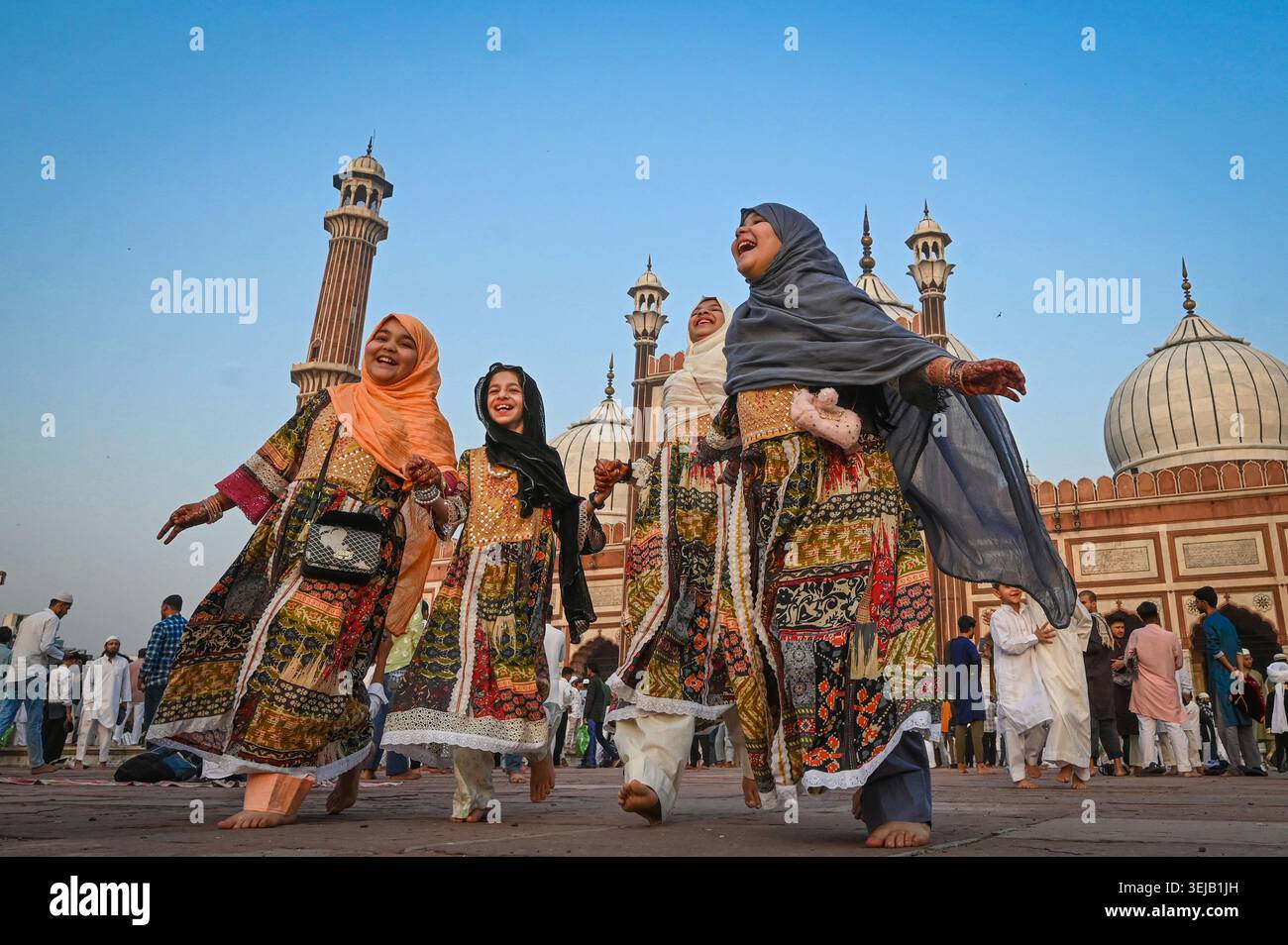 NEW DELHI, INDIA - MAY 28: Muslim children dressed in festive attire in ...