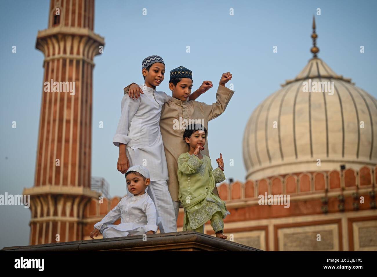 NEW DELHI, INDIA - MAY 28: Muslim children dressed in festive attire in ...