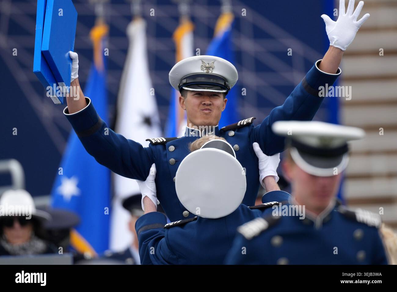 A cadet reacts after receiving a diploma during the United States Air ...