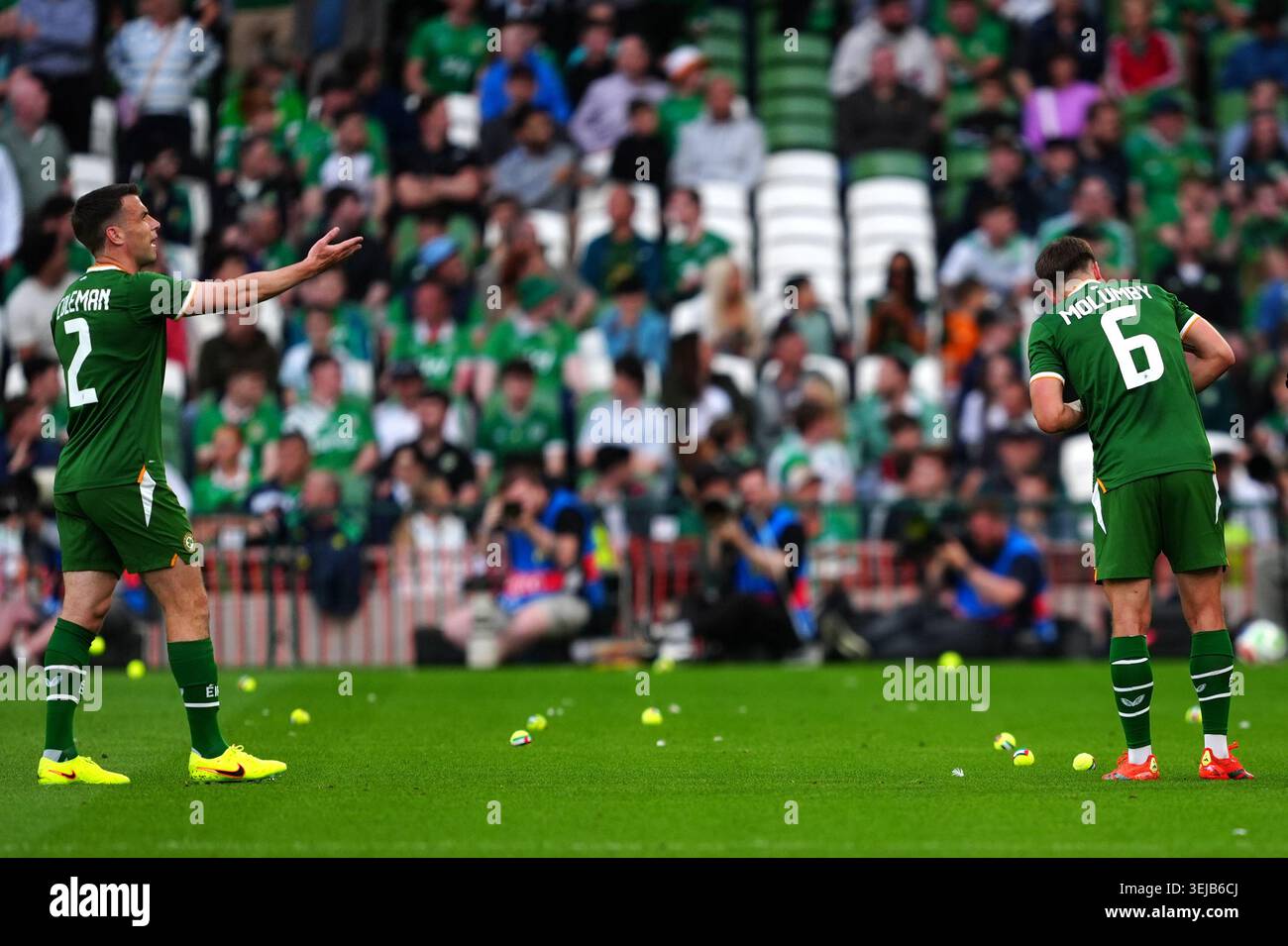 Republic of Ireland's Seamus Coleman reacts as tennis balls are thrown ...