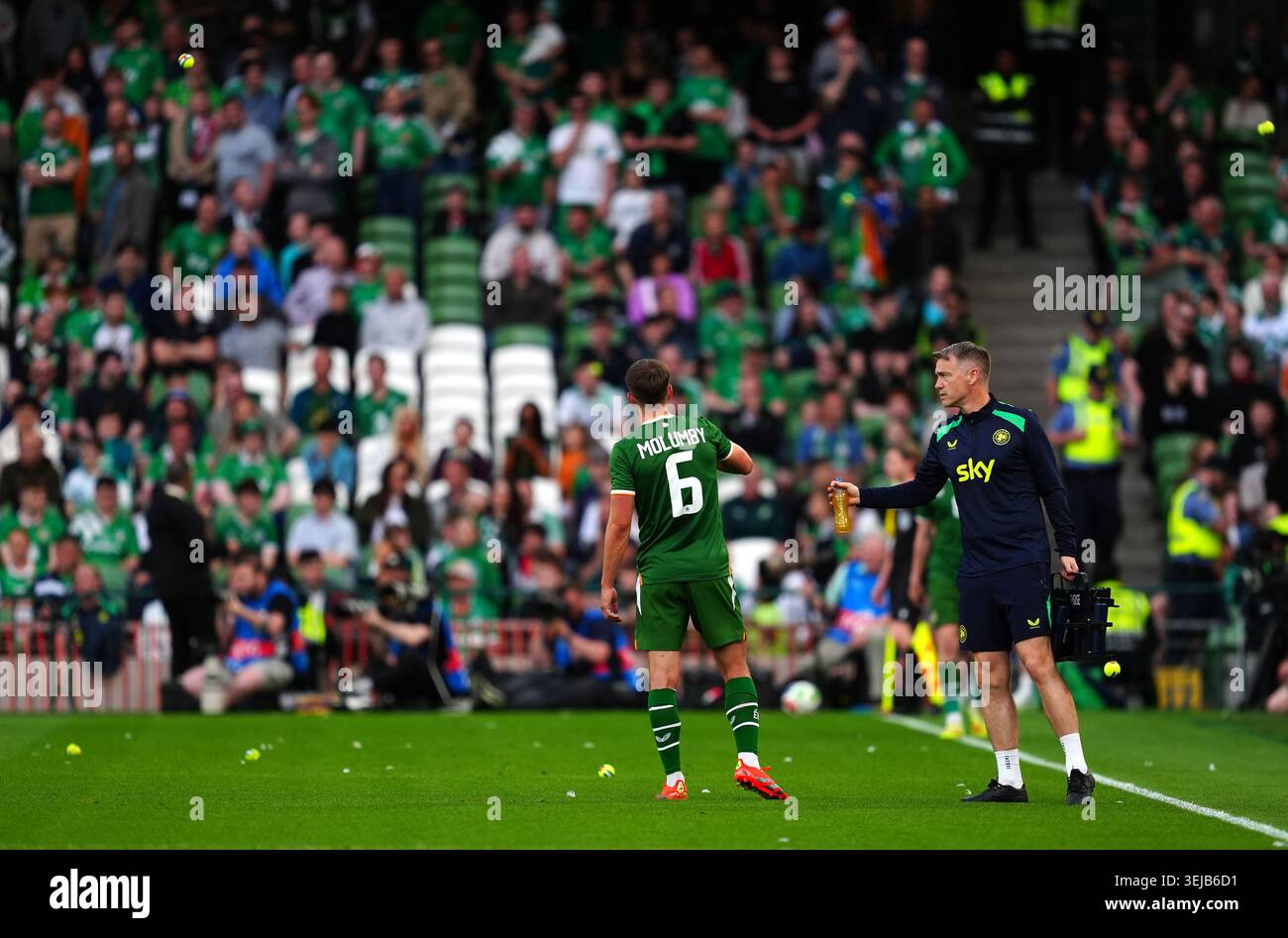 Republic of Ireland's Jayson Molumby reacts as tennis balls are thrown ...