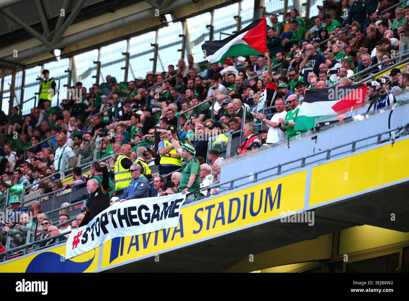 A #STOPTHEGAME boycott banner and Palestine flags in the stands during ...