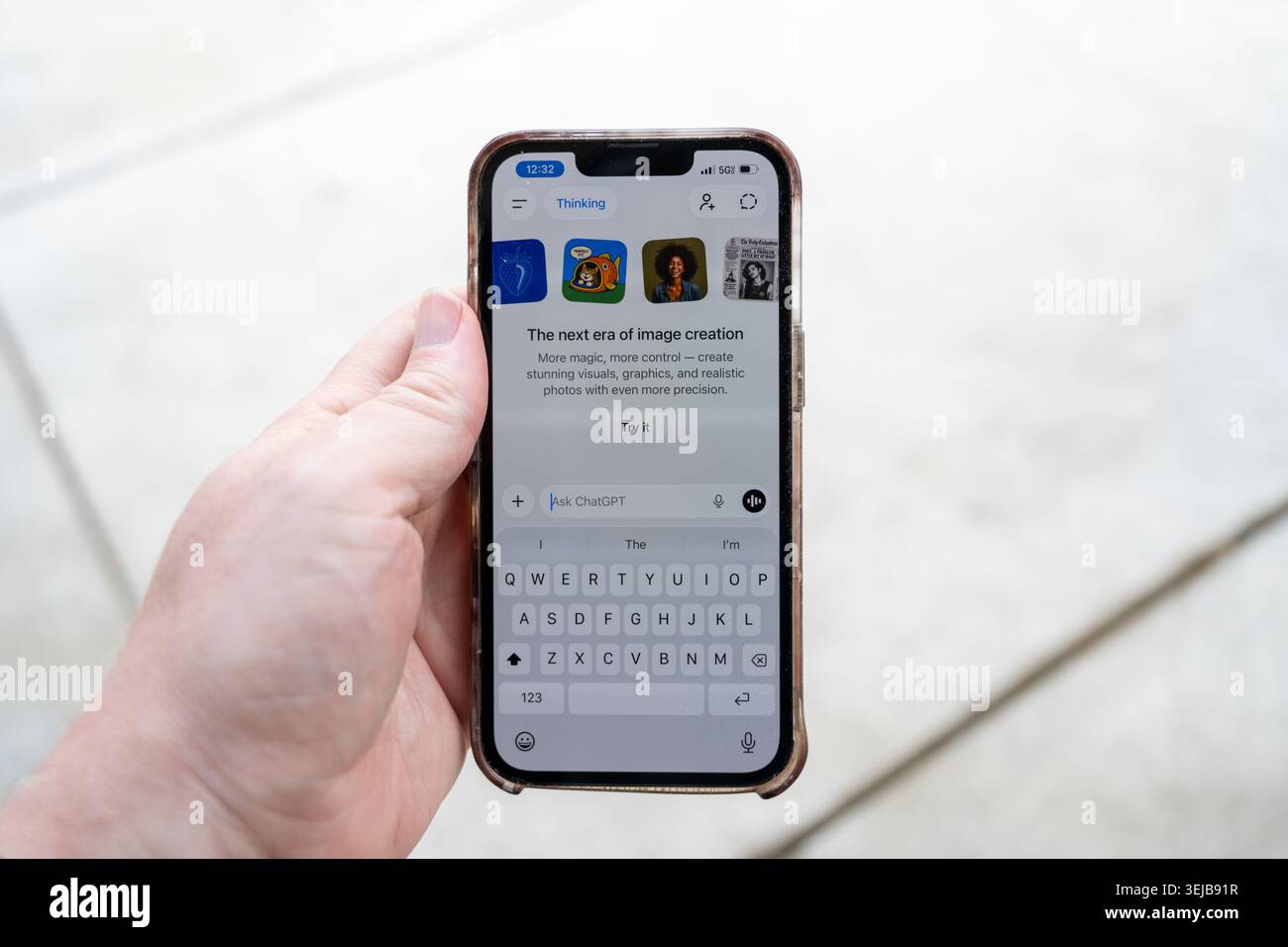 Close-up of person's hand holding a smartphone and using the ChatGPT ...