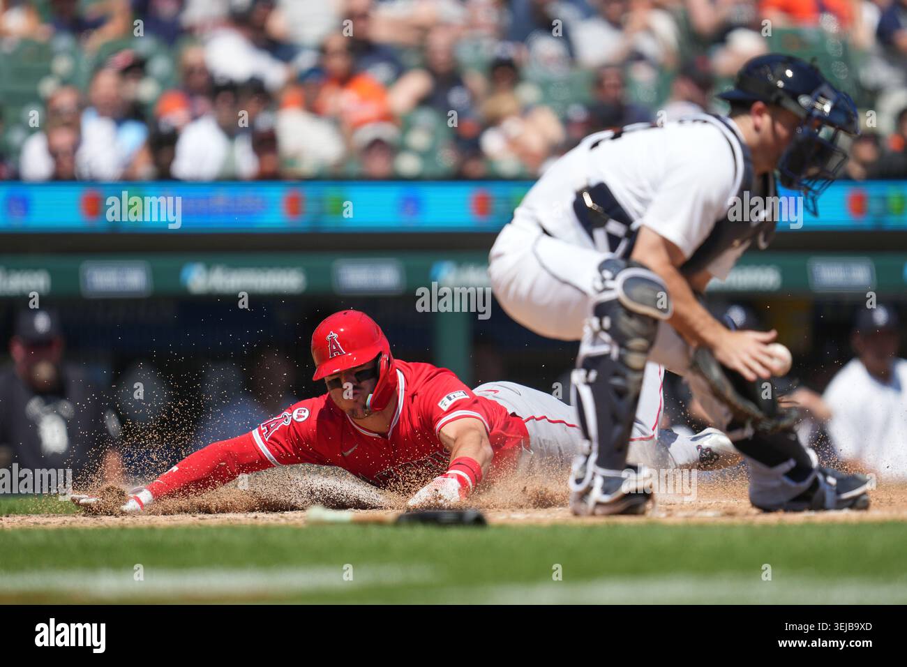 Los Angeles Angels' Mike Trout, left, slides safely into home plate as ...
