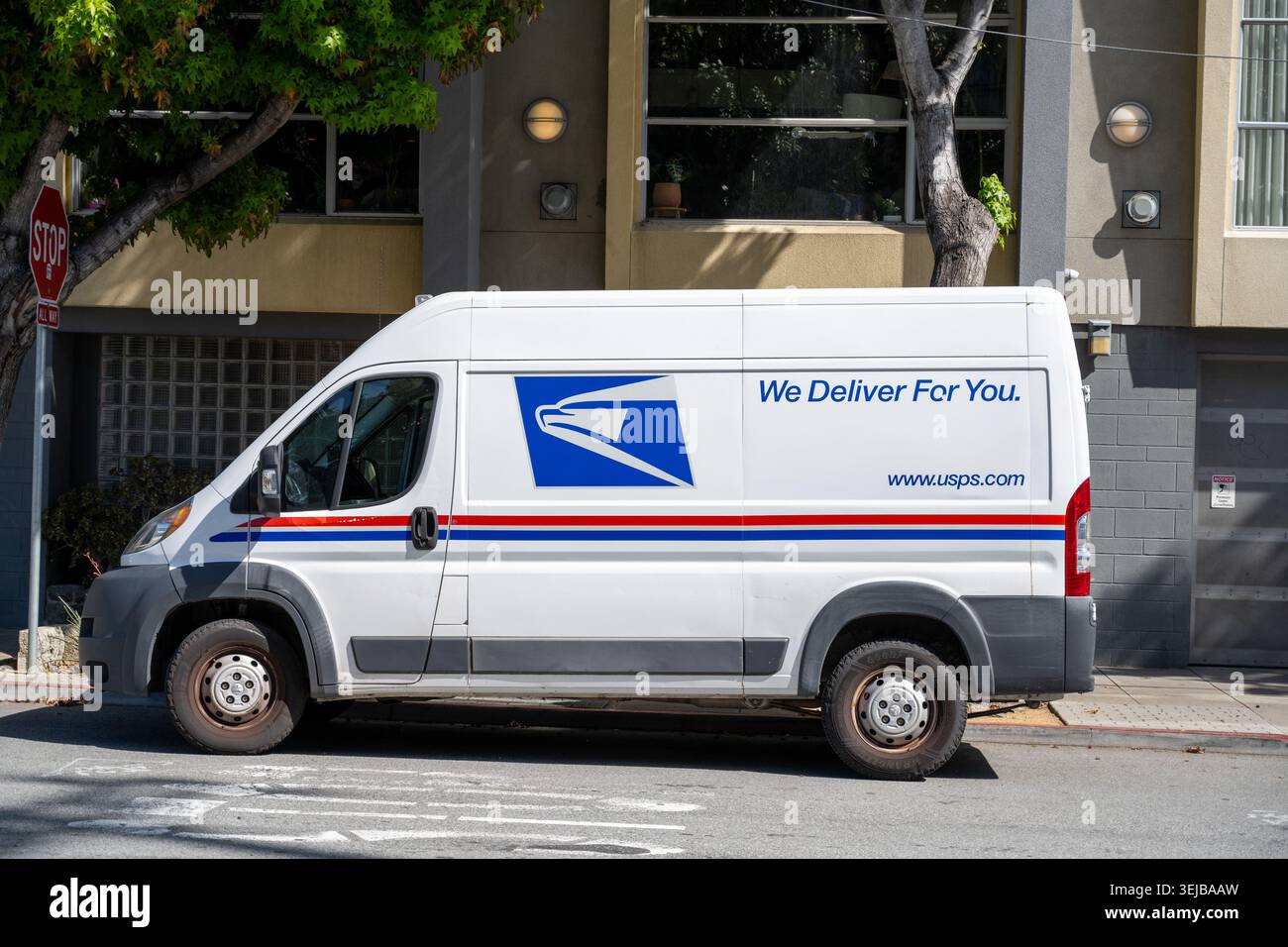 United States Postal Service delivery van parked on residential street ...