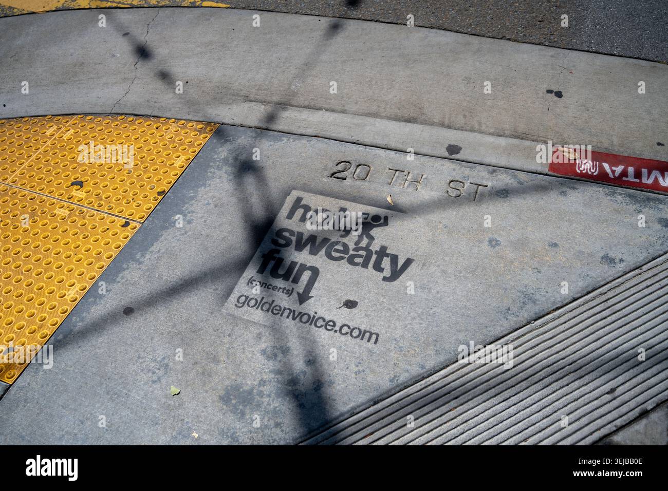 Sidewalk corner at 20th Street with yellow tactile paving, Muni curb ...