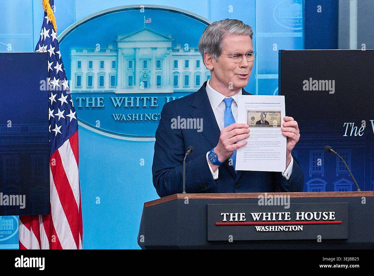 Treasury Secretary Scott Bessent holds up an image of the proposed 250 ...