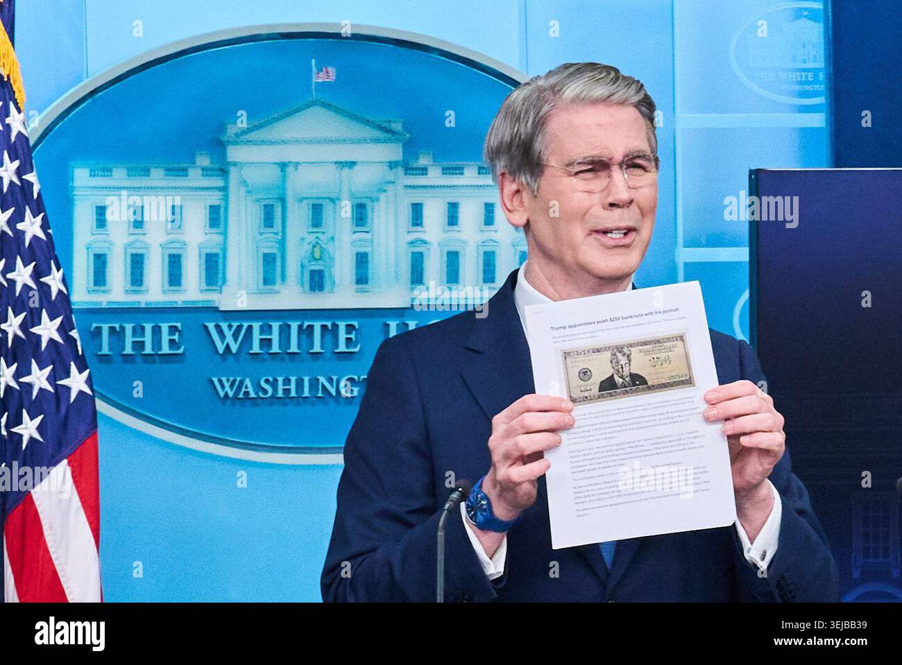 Treasury Secretary Scott Bessent holds up an image of the proposed 250 ...