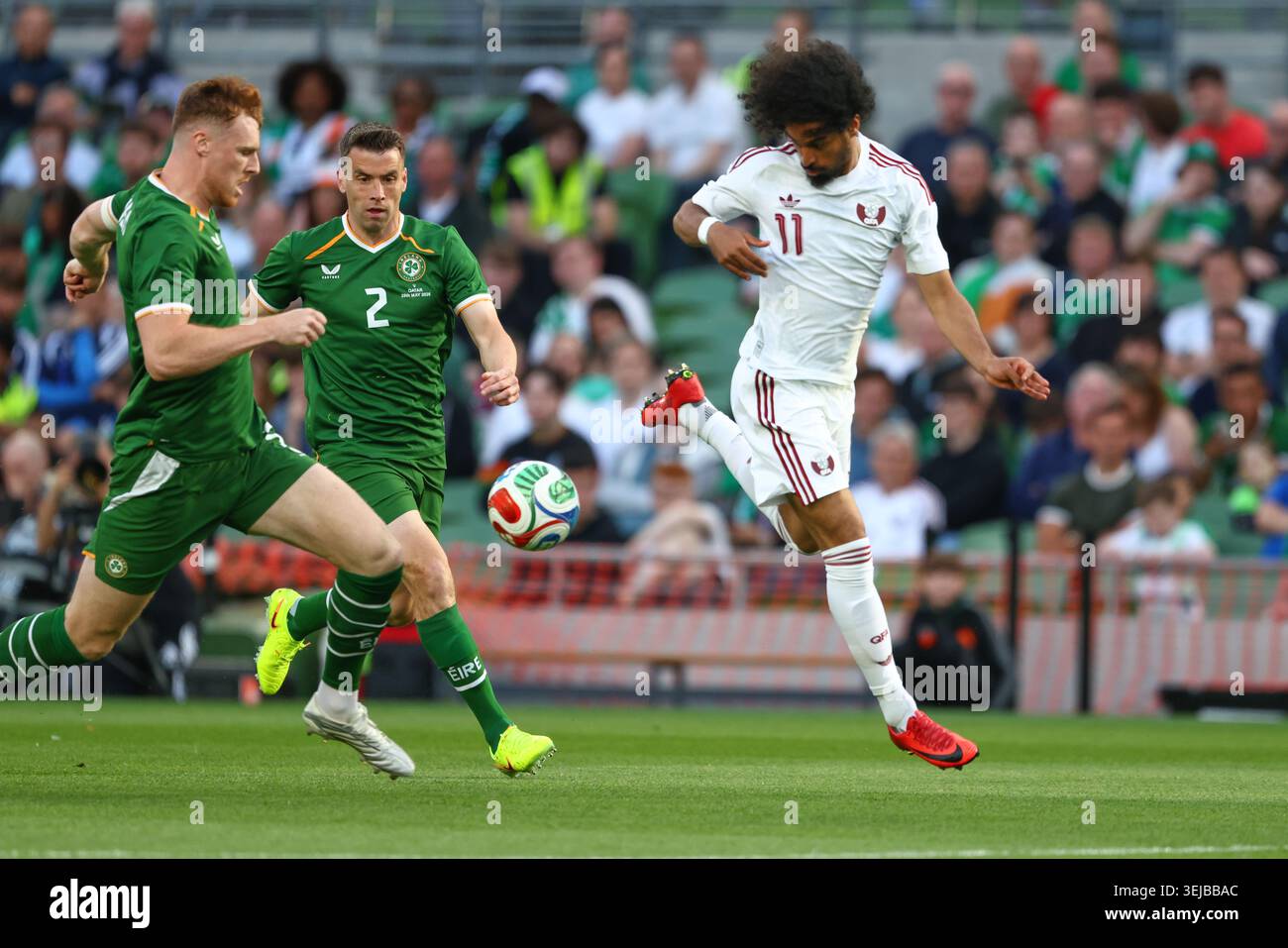 Qatar's Akram Afif, right, in action against Ireland's Jake O'Brien ...