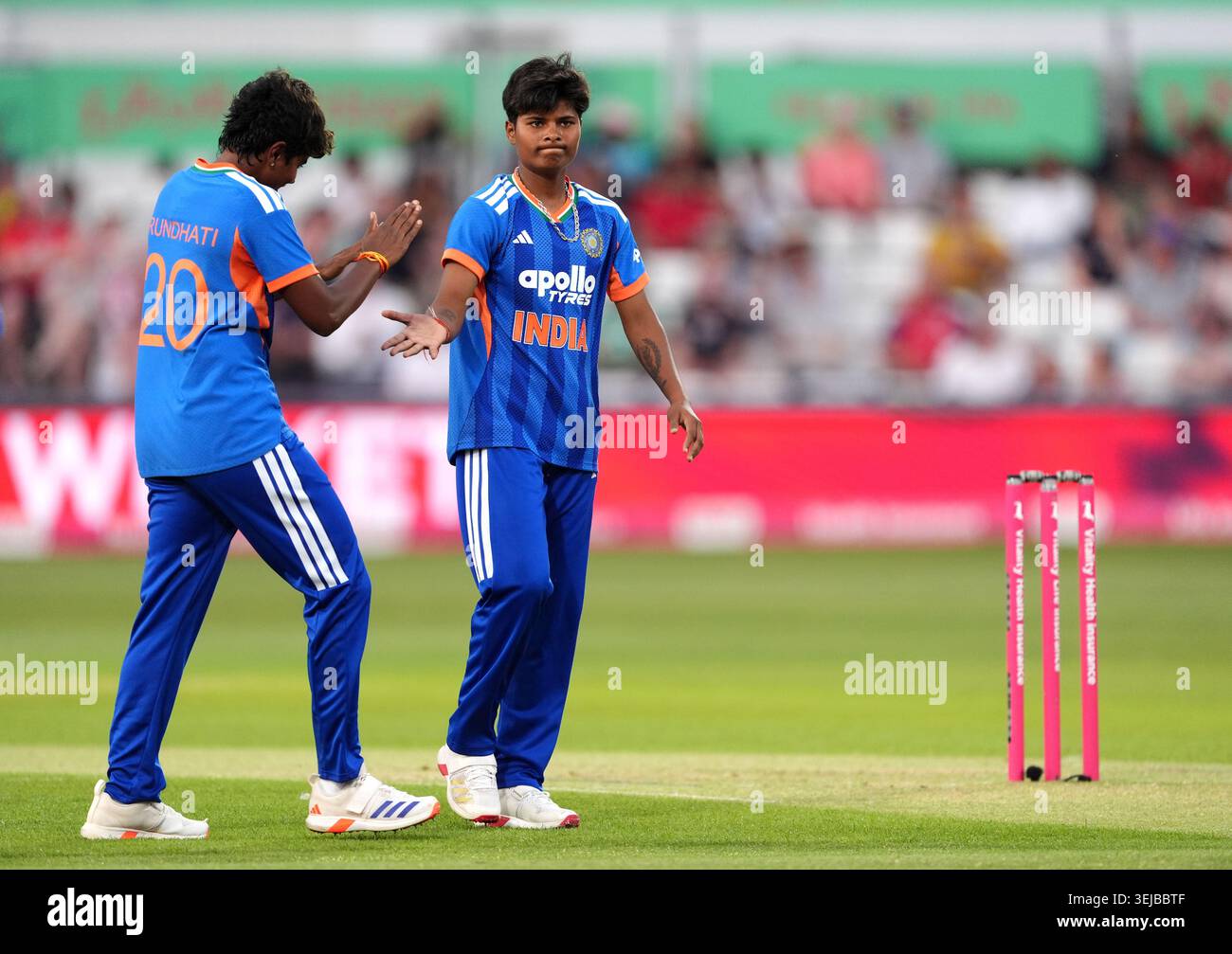 India's Arundhati Reddy and Kranti Gaud celebrate the wicket of England ...