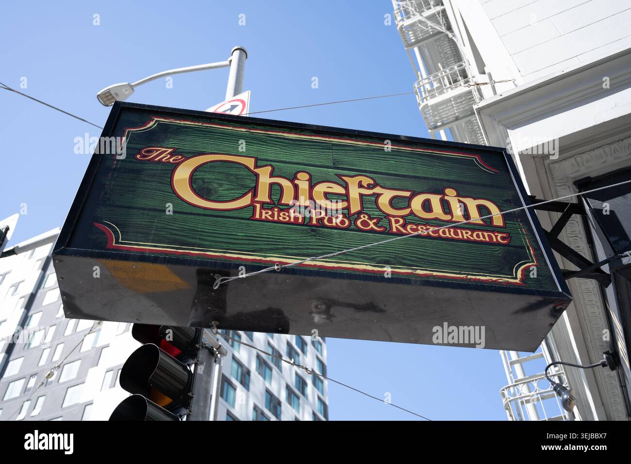 Sign for The Chieftain Irish Pub and Restaurant hanging above a city ...