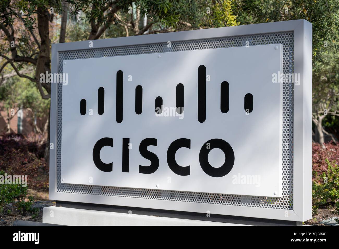Cisco logo on outdoor sign surrounded by landscaping on a sunny day ...