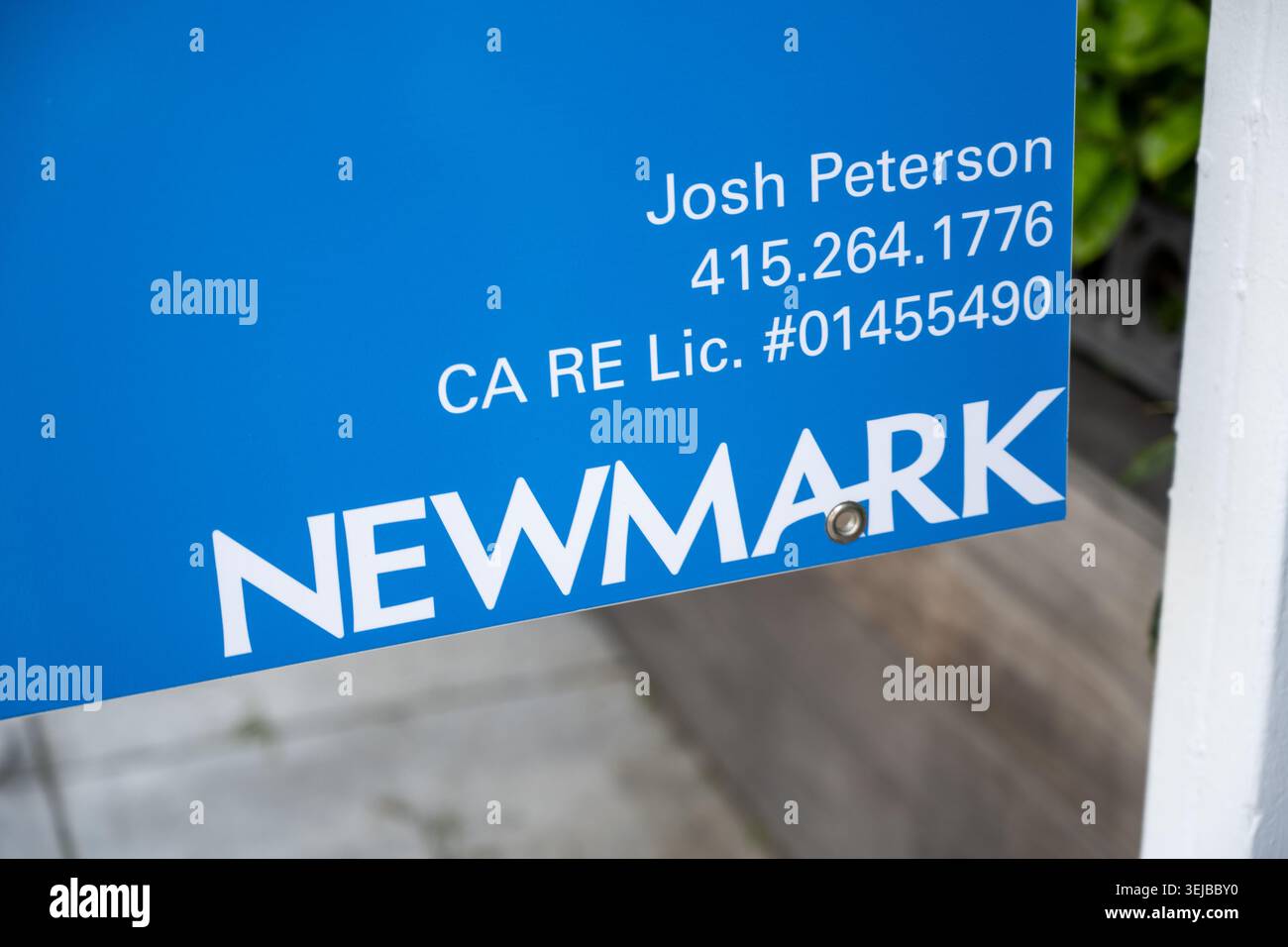 Close-up of Newmark real estate agent sign with contact information and ...