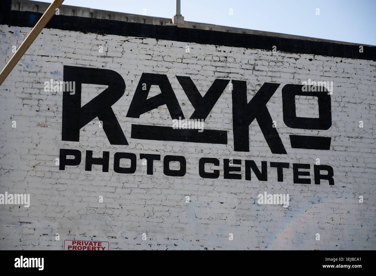 RayKo Photo Center sign painted on exterior brick wall of a building on ...