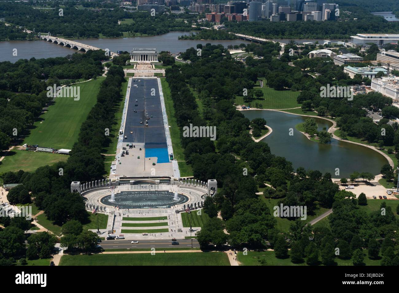 The Reflecting Pool under renovation and partially coated with blue is ...