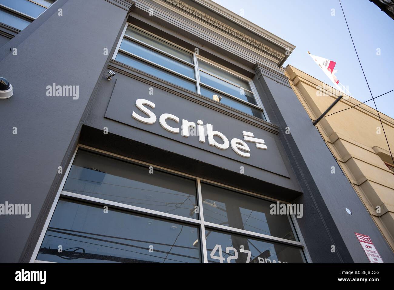 Exterior of gray commercial building with Scribe sign and California ...