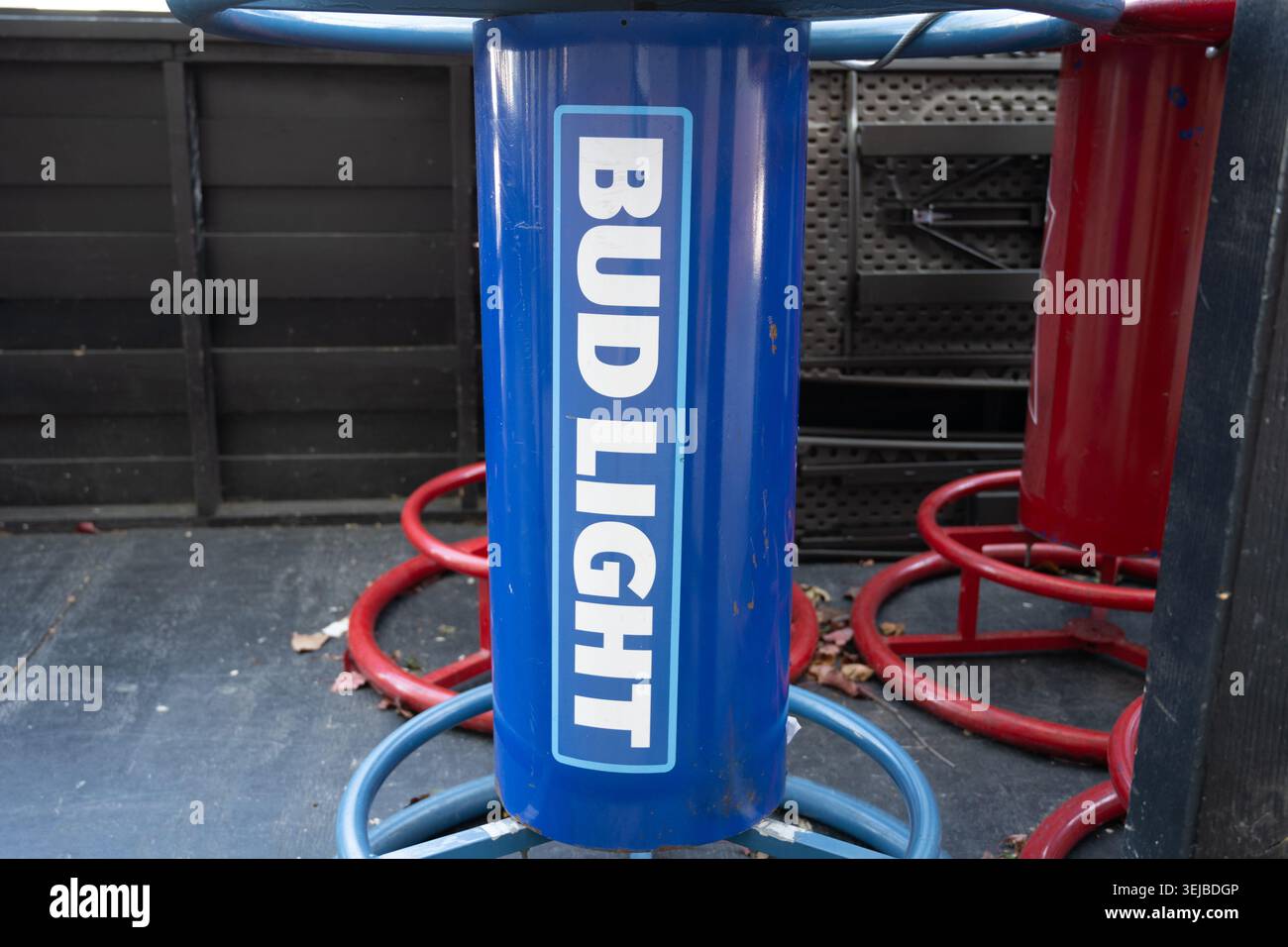 Close-up of blue Bud Light branded outdoor bar table base with red ...