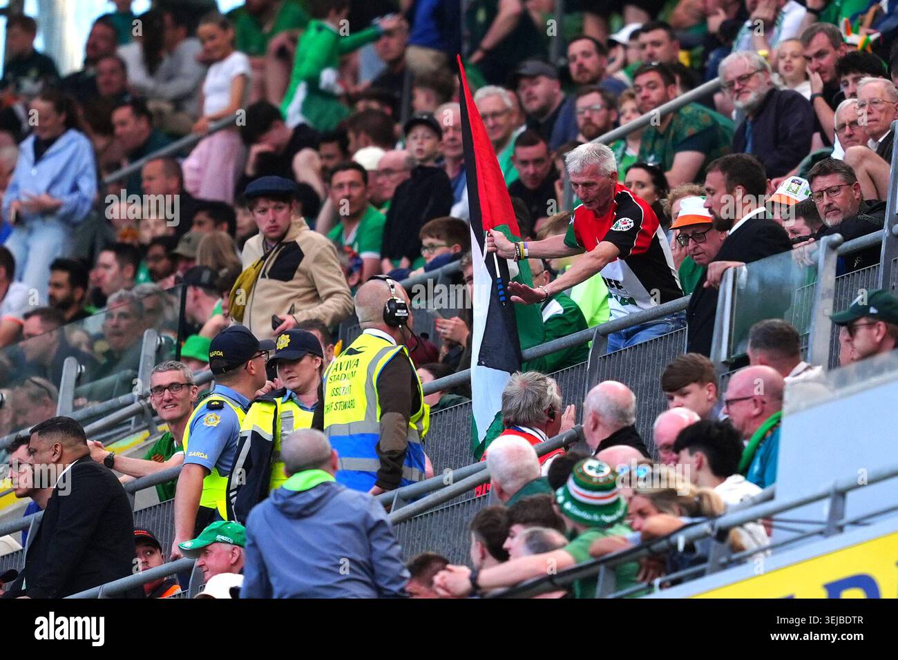 Gardai address fans waving Palestine flags in the stands during an ...