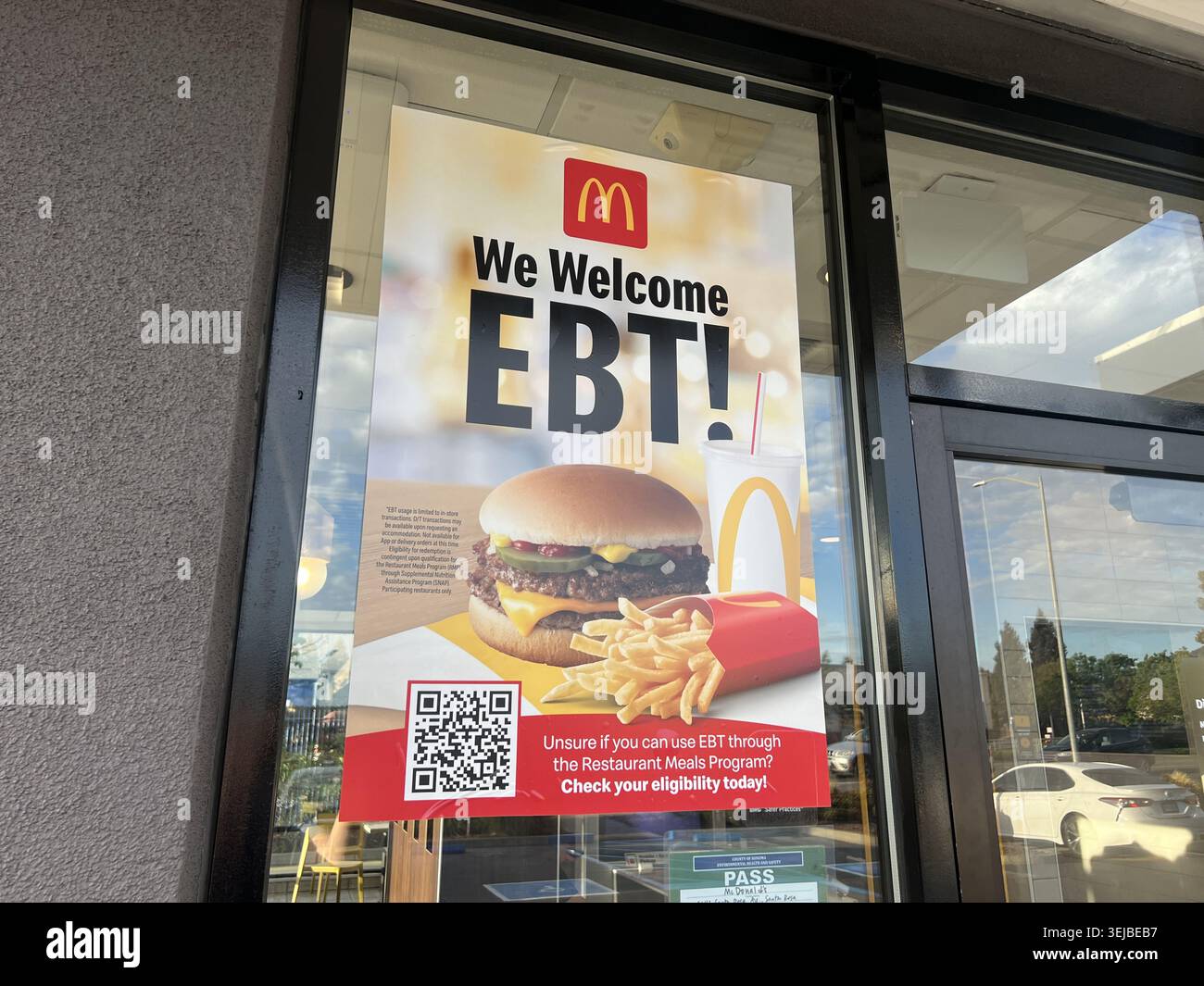 Sign with text reading We Welcome EBT at a McDonald's restaurant in ...