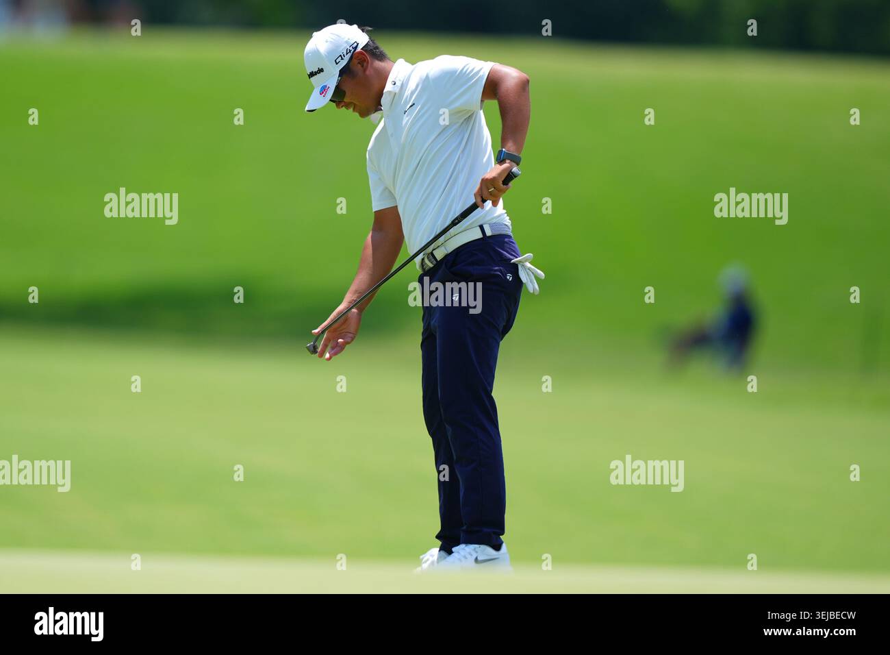 Ryo Hisatsune, of Japan, reacts to missing a putt on the 11th hole ...