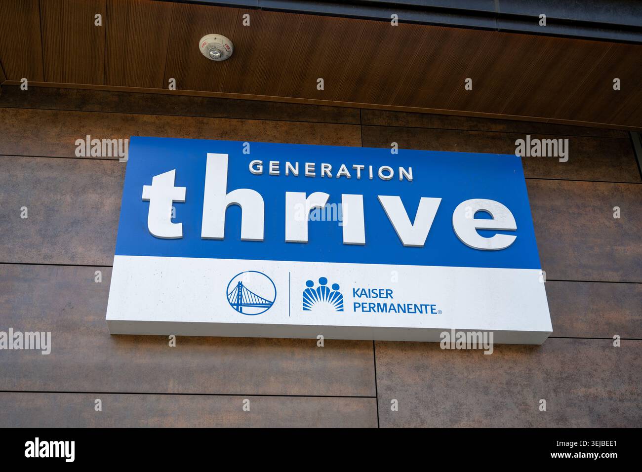Generation Thrive and Kaiser Permanente logo sign on exterior of a ...