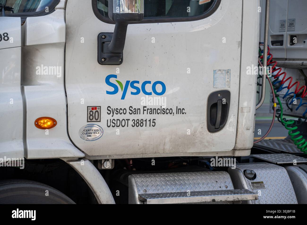Side view of Sysco delivery truck cab with company logo and safety ...