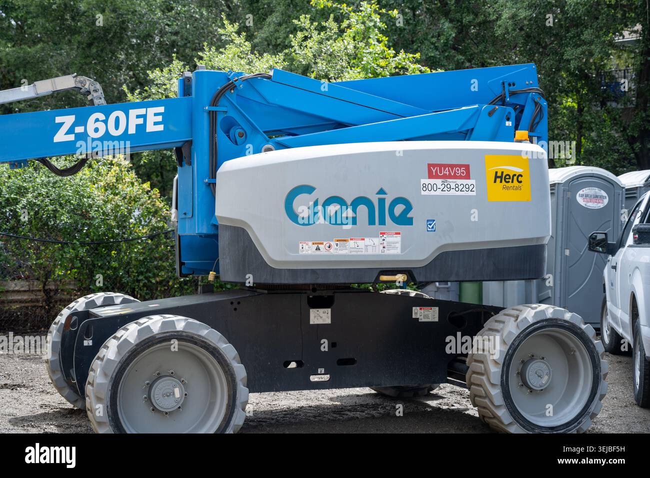 Genie Z-60FE boom lift with Herc Rentals branding parked at an outdoor ...