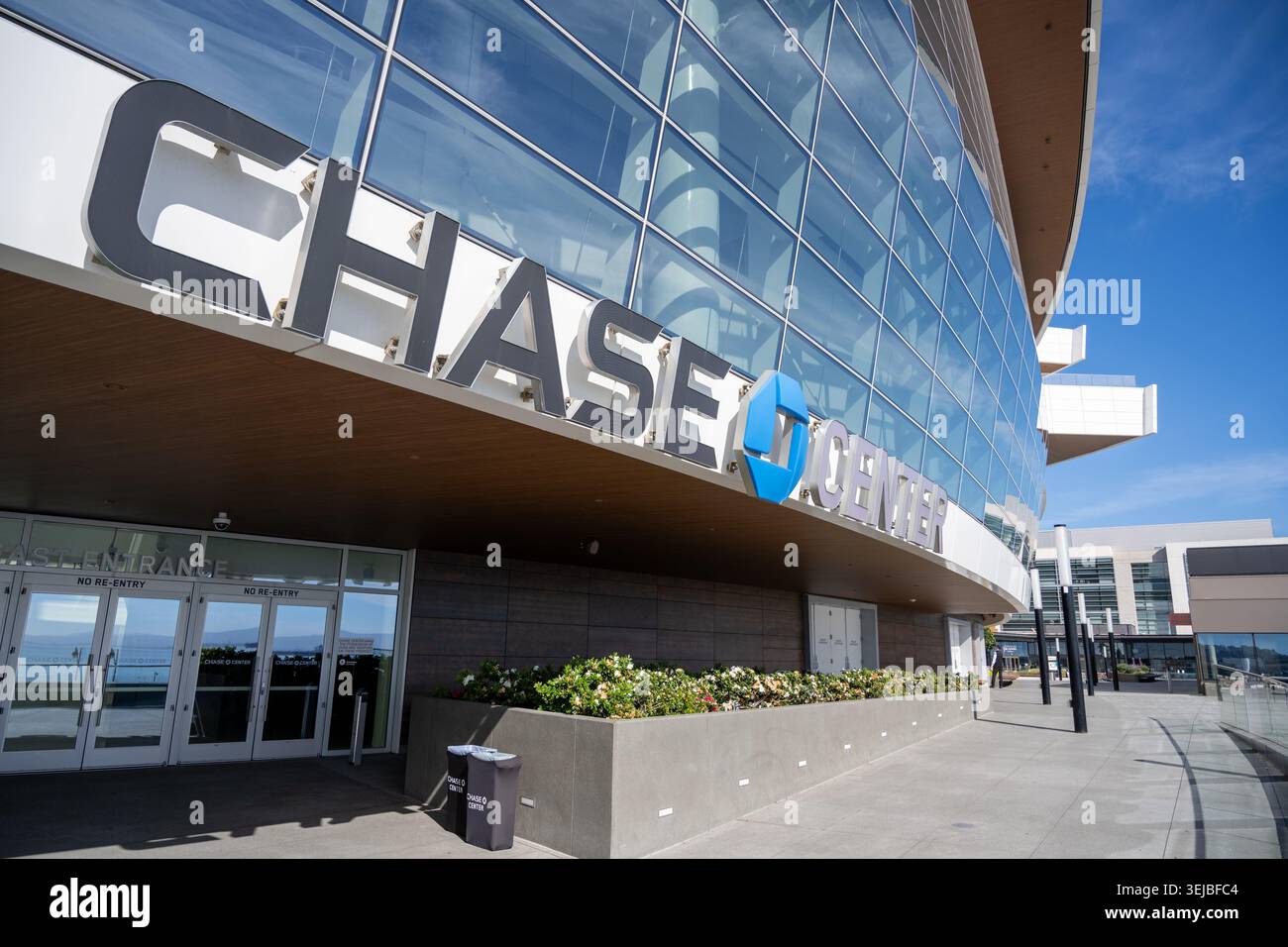 Exterior view of Chase Center arena with large logo and glass facade on ...